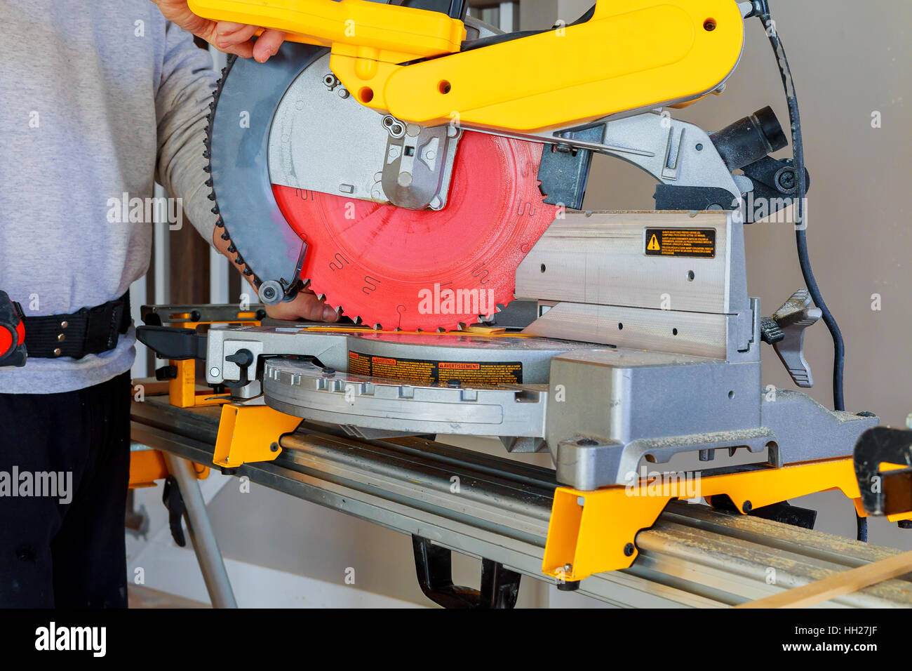 man cutting wood on electric saw Circular saw cutting wooden Stock ...