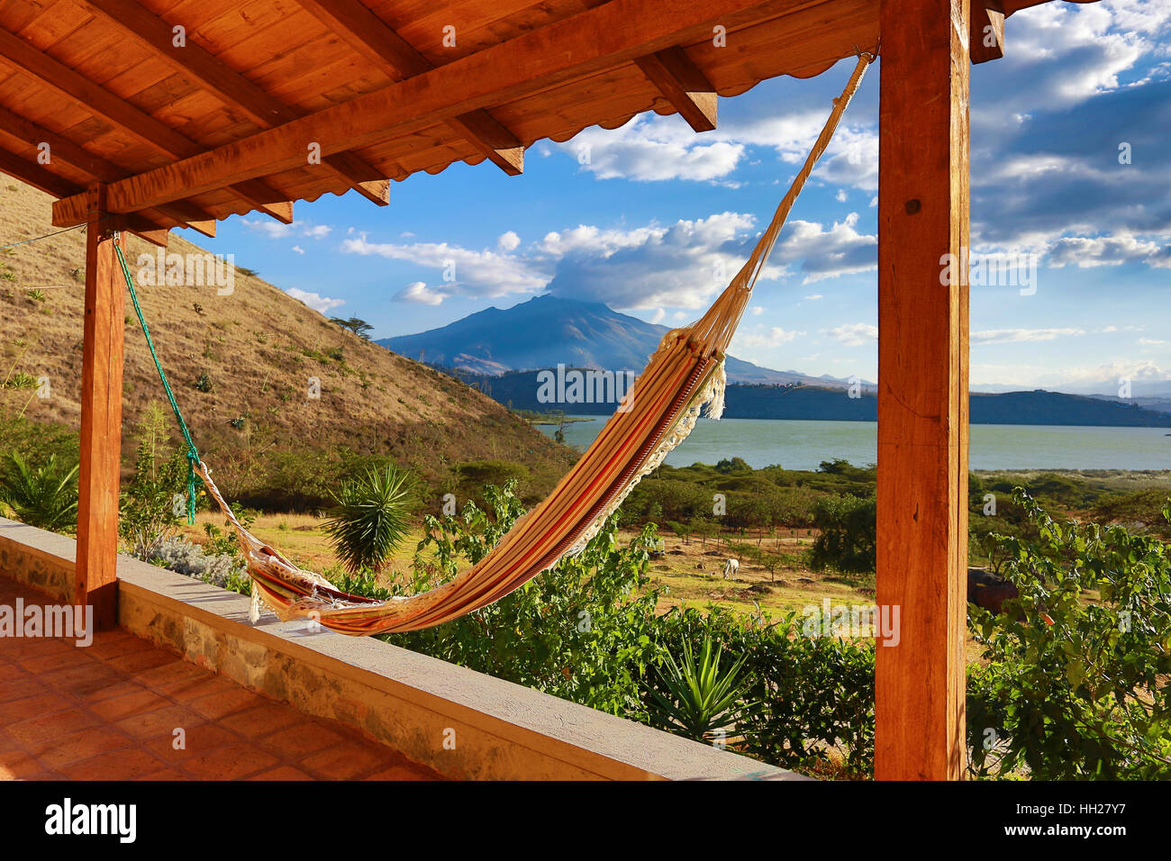 Hammock between two poles at a lodge near Lake Yahuarcocha, Ibarra ...