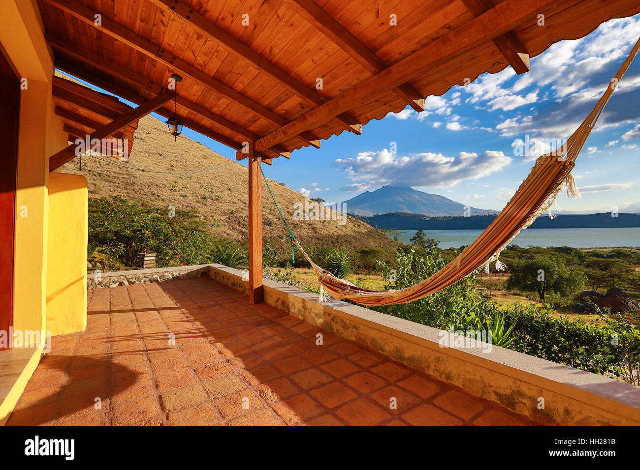 hammock on a patio with volcano in the background in Lake Yahuarcocha ...
