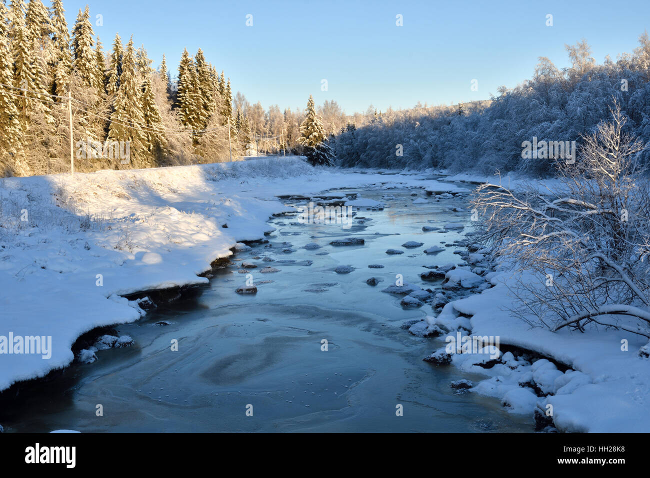 Frozen stream with ice and frosty forest , picture from the North of ...