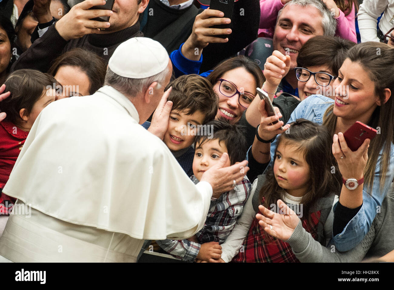 Pope Francis caresses children as he arrives for a special audience ...