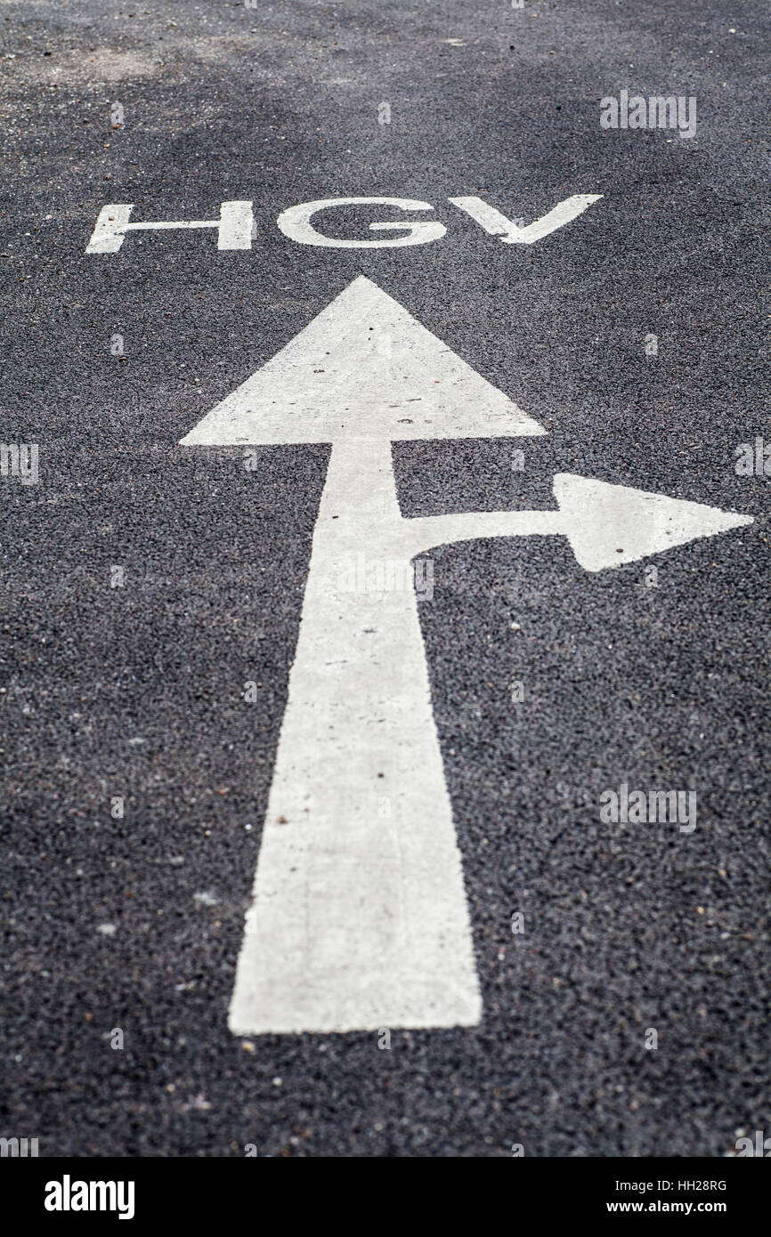 HGV ahead sign with white painted arrow on the tarmac Stock Photo - Alamy