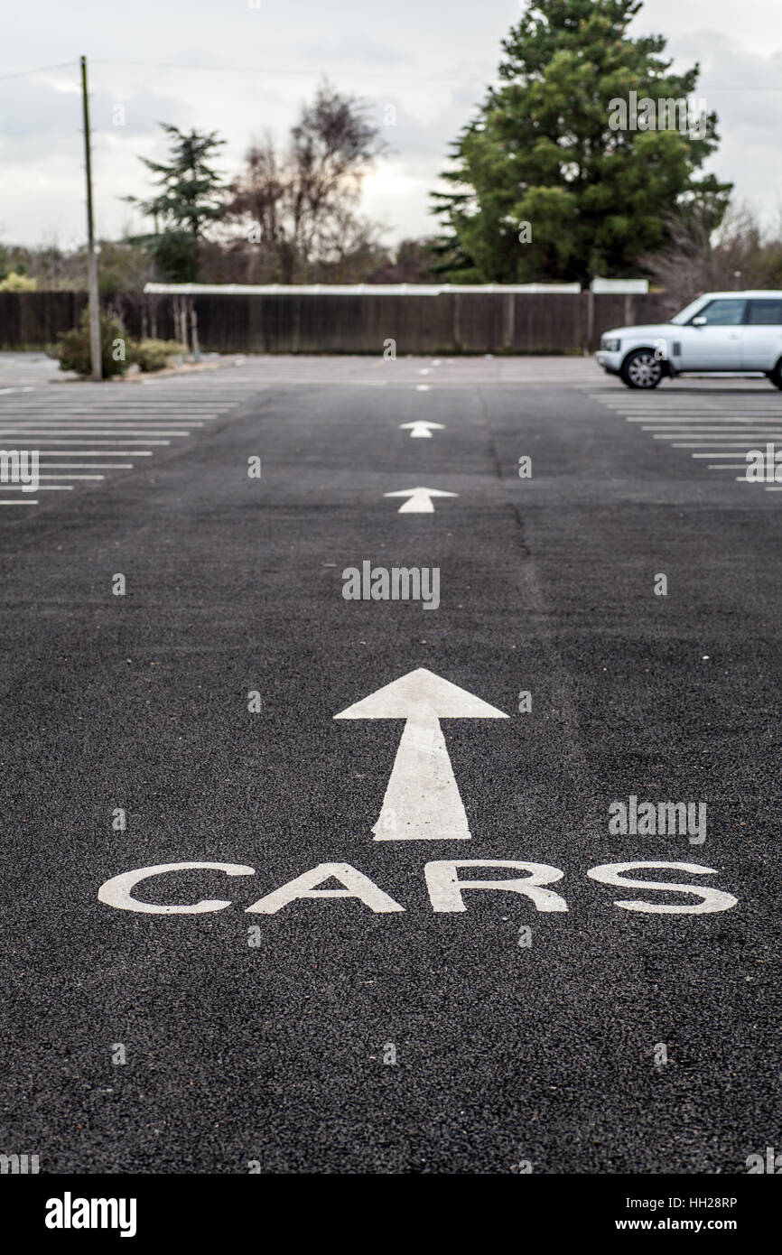 White ahead only sign painted on the ground in a car park Stock Photo ...