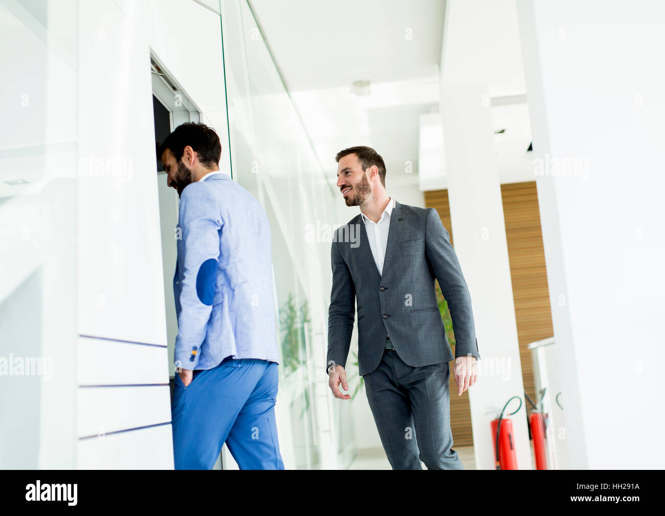 Teamwork walking at door in the office Stock Photo - Alamy