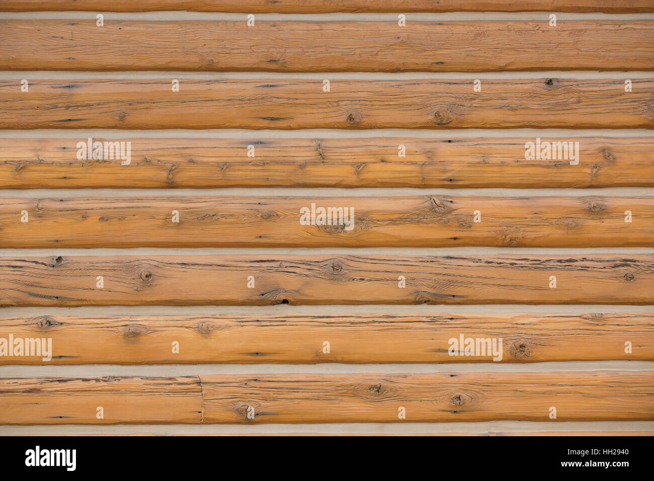 Log wall on a building Stock Photo - Alamy