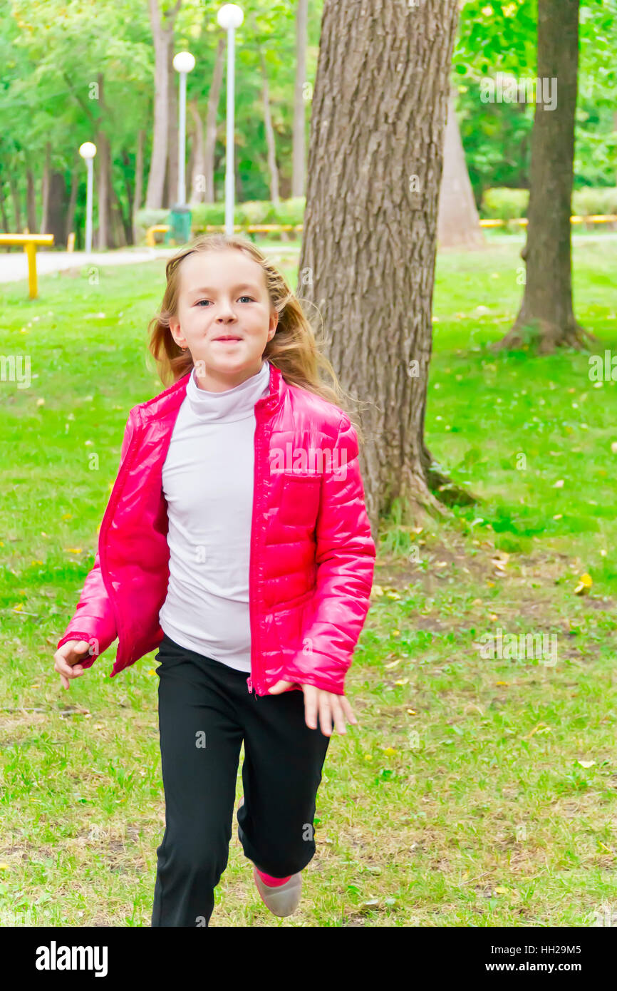 Photo of cute running girl in summer Stock Photo - Alamy