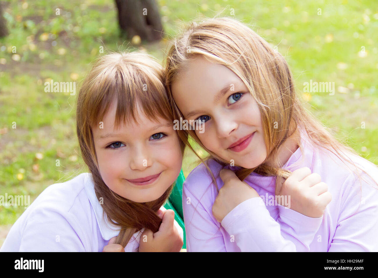 Photo of two playing girls in summer Stock Photo - Alamy