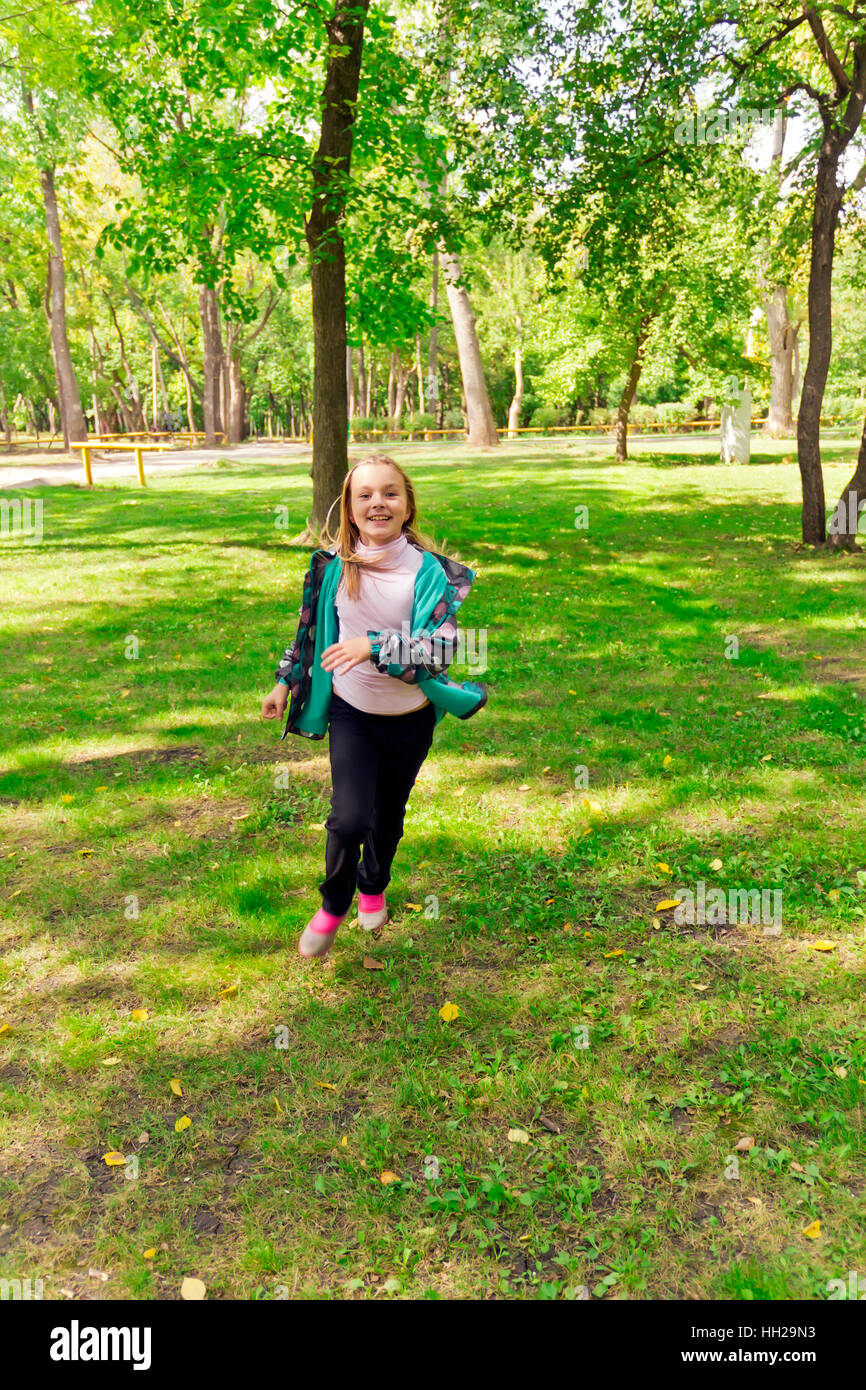 Photo of cute running girl in summer Stock Photo - Alamy