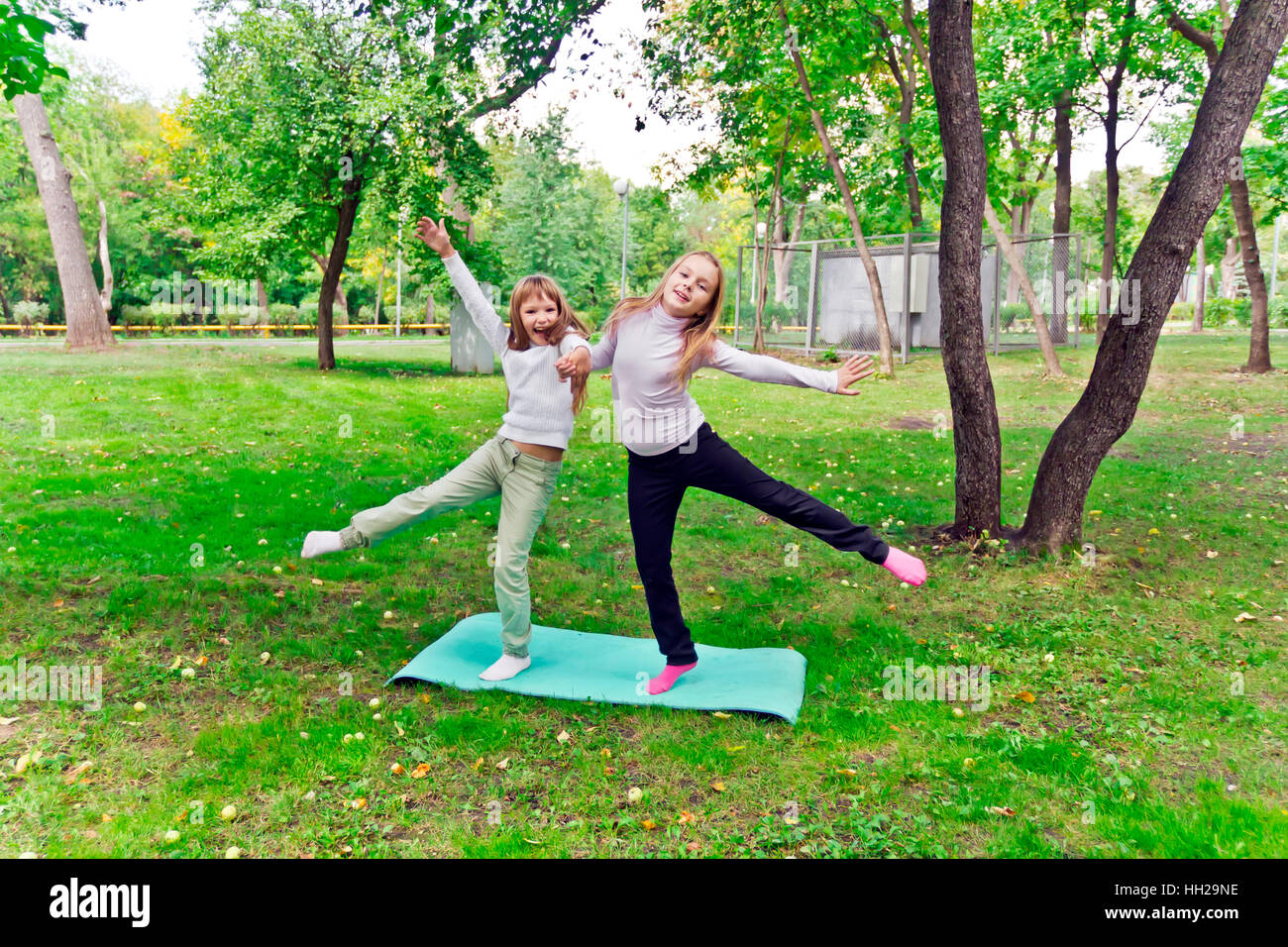 Photo of two playing girls in summer Stock Photo - Alamy