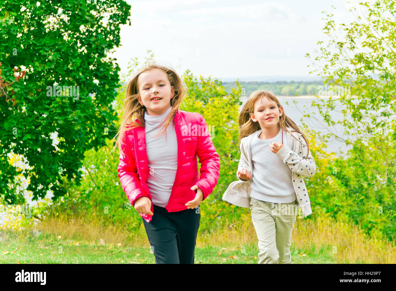 Photo of two running girls in summer Stock Photo - Alamy