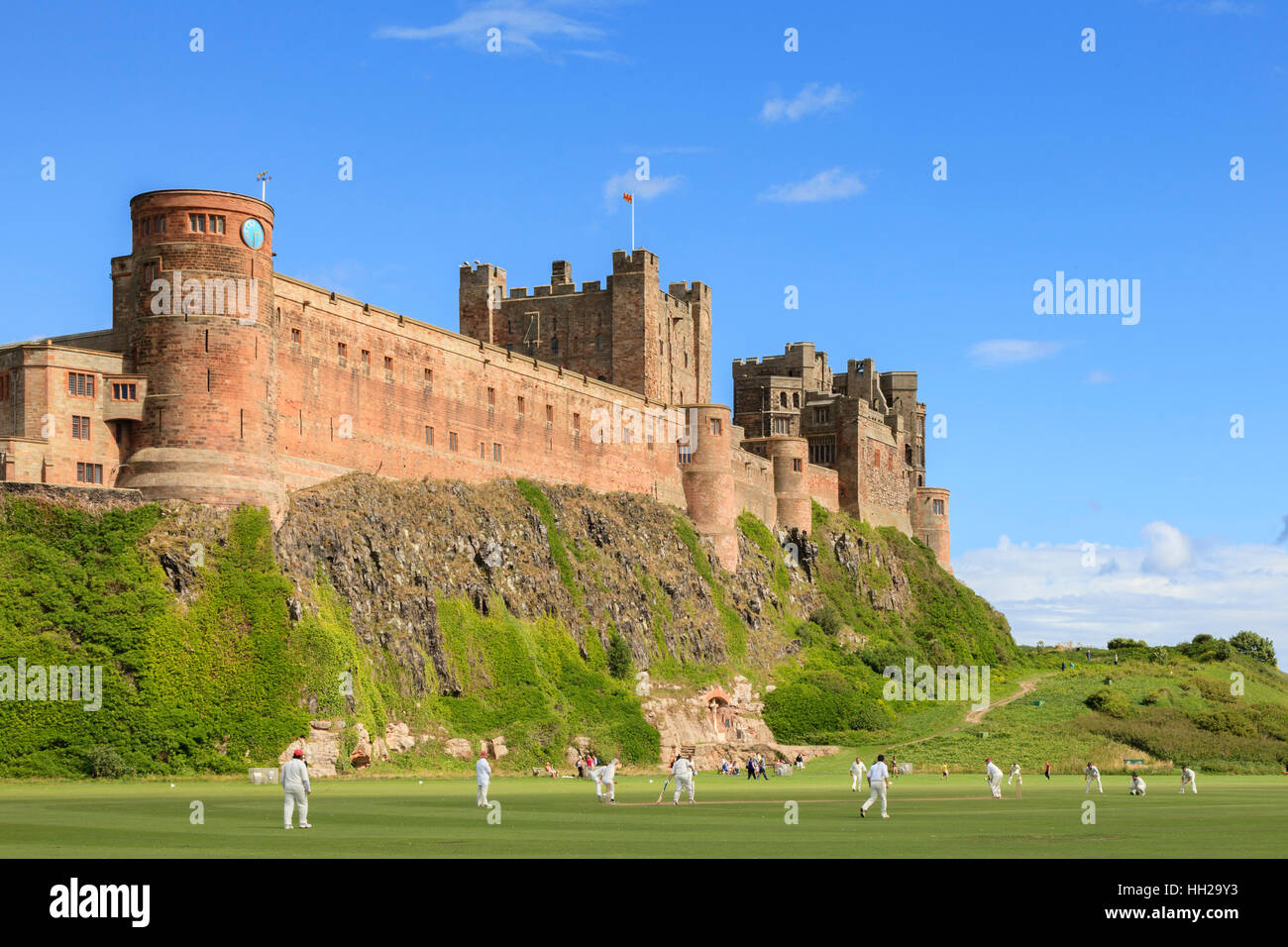 Quintessential England? Cricket being played under the imposing edifice ...