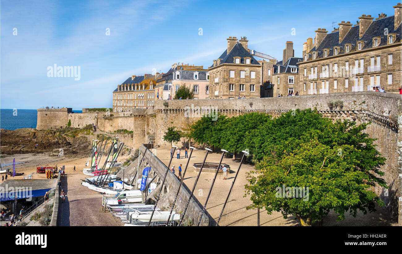 The buildings, catamarans and boats on beach Bon Secours in Saint-Malo ...