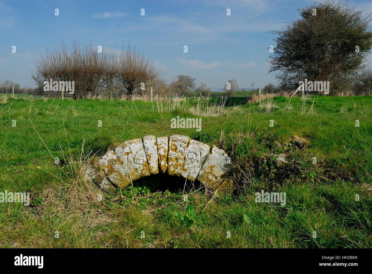 The remains of a sunken/overgrown footbridge dated 1691, originally ...