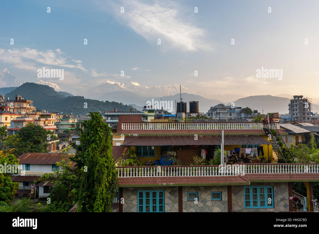 Morning rooftop view of mountains rising in distance Stock Photo - Alamy