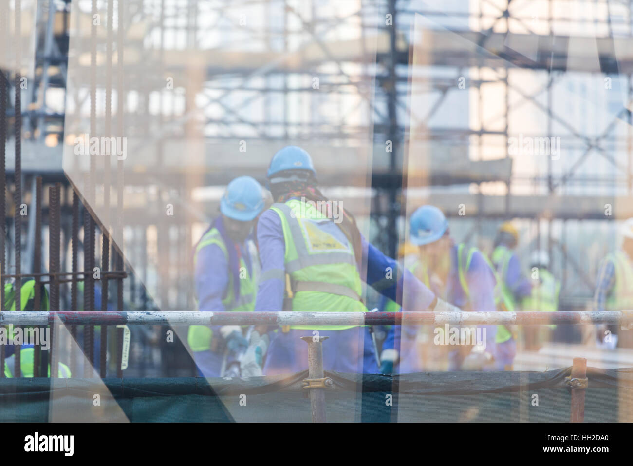 Team of construction worker on construction site Stock Photo - Alamy