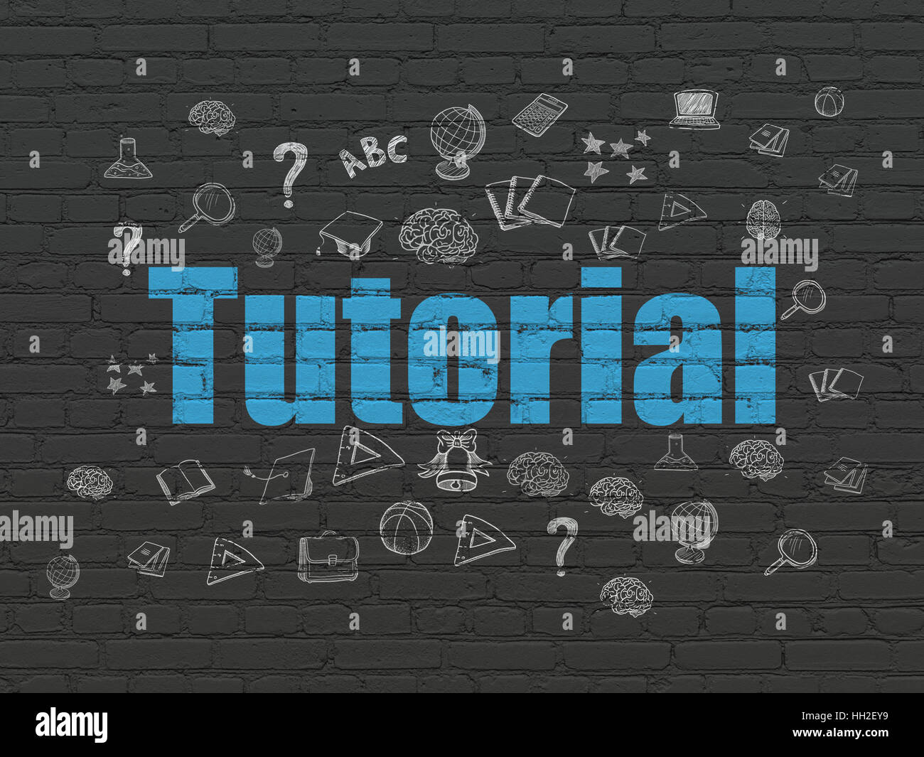 Learning concept: Tutorial on wall background Stock Photo - Alamy
