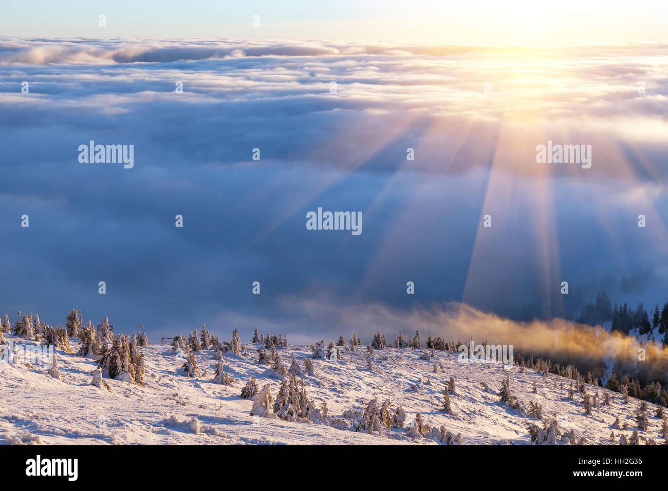 Sun over winter mountains, covered with snow Stock Photo - Alamy