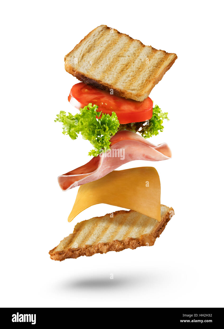 Fresh sandwich with flying ingredients isolated on white background ...