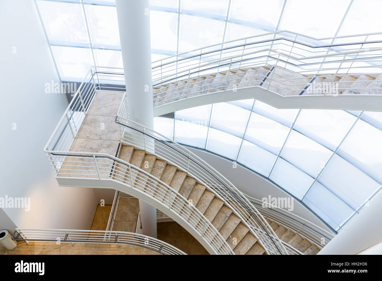 Ladder in house with white interior Stock Photo - Alamy