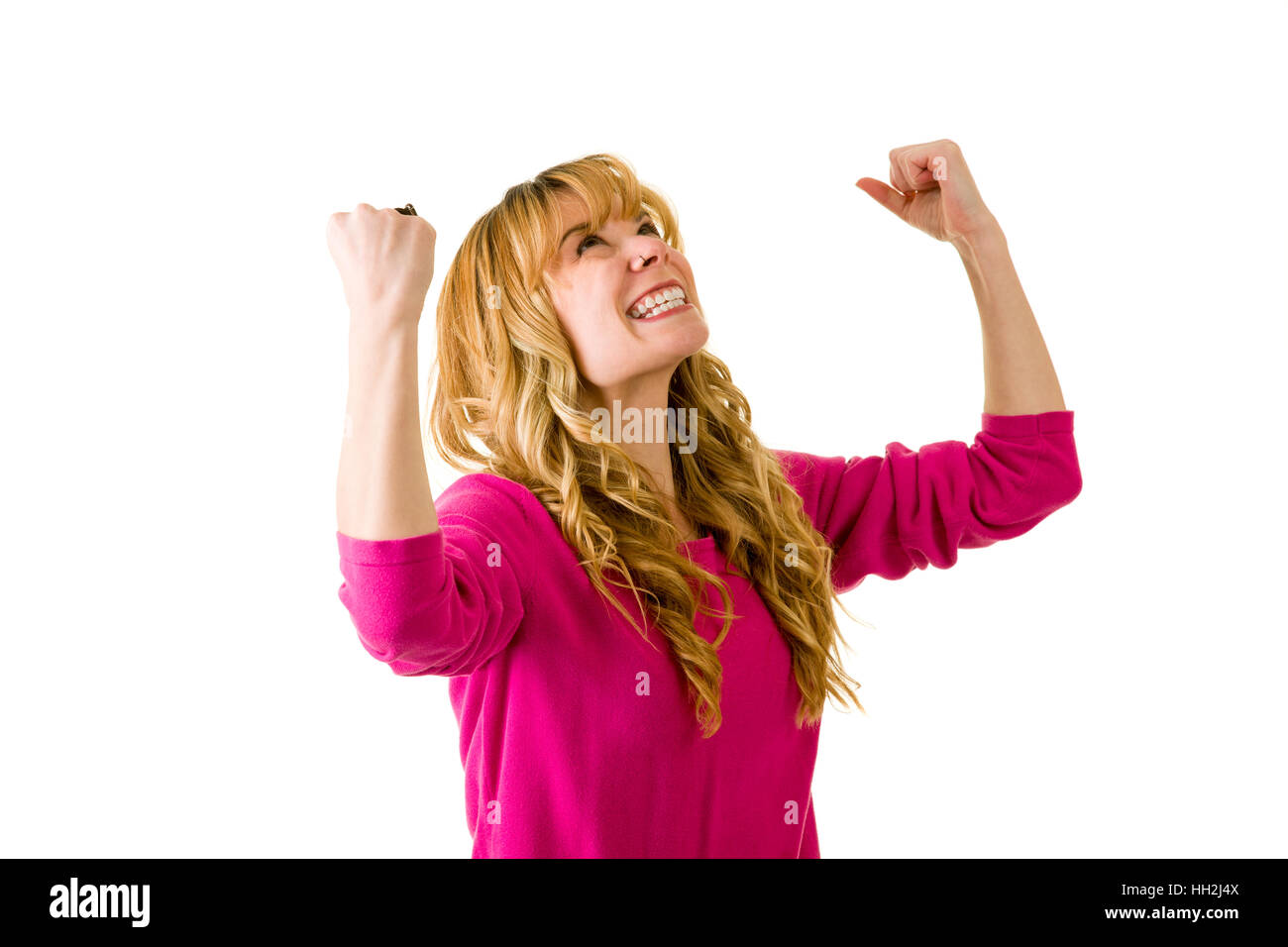 Woman throws arms up in success Stock Photo - Alamy