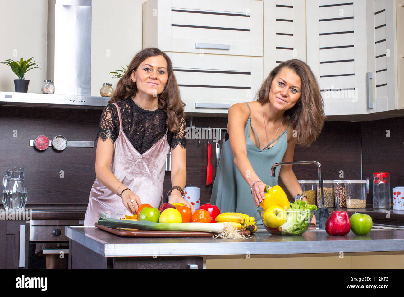 Twins on kitchen in the morning, cooking something for breakfast Stock ...