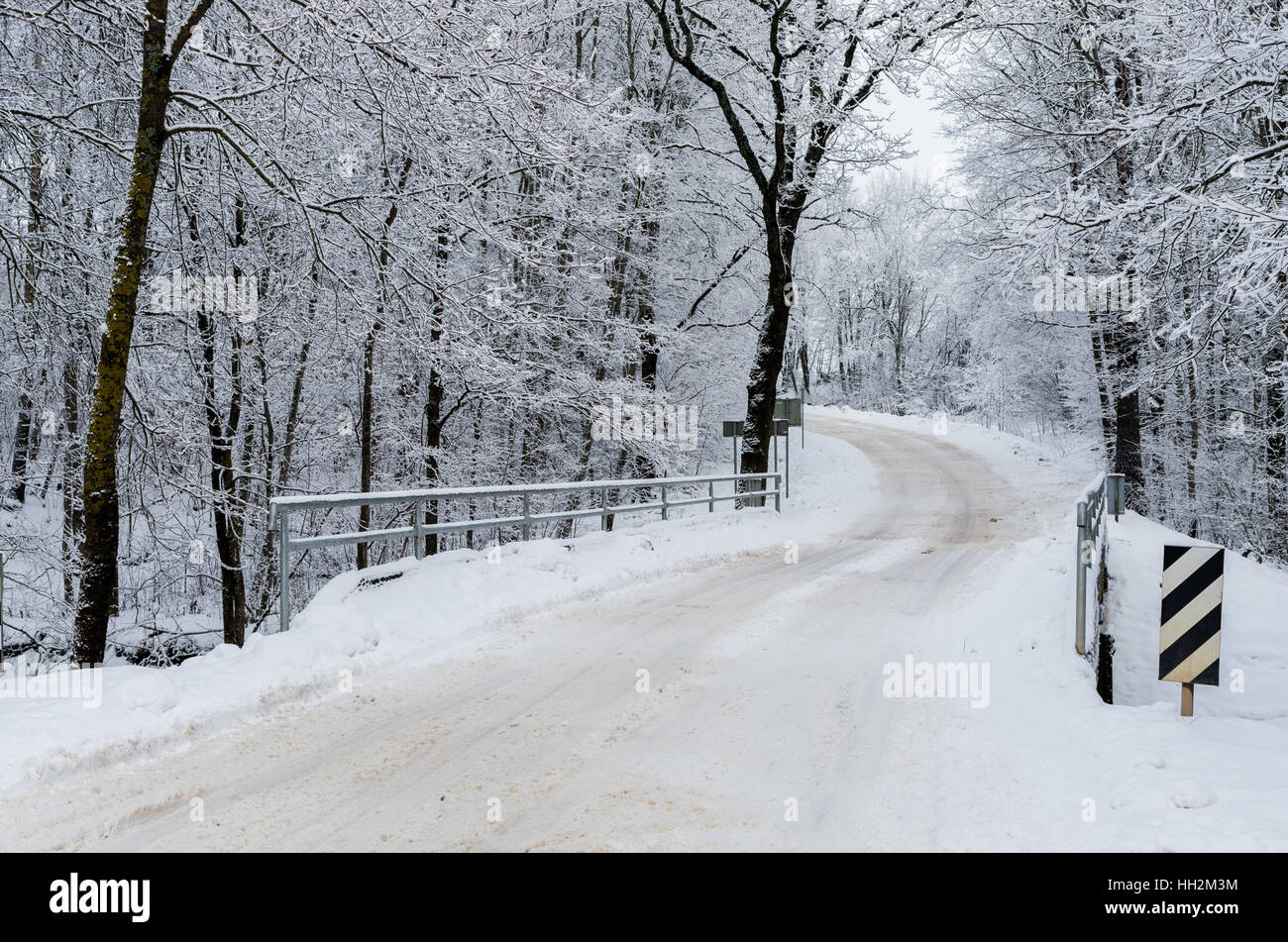 Road covered winter snow in the forest Stock Photo - Alamy