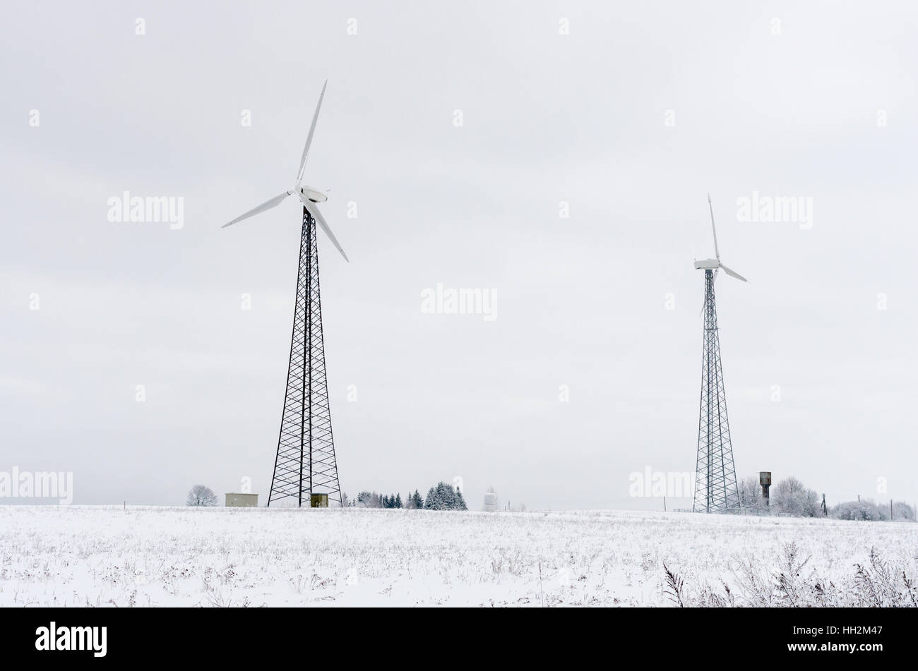 Two modern wind turbines in winter landscape Stock Photo - Alamy