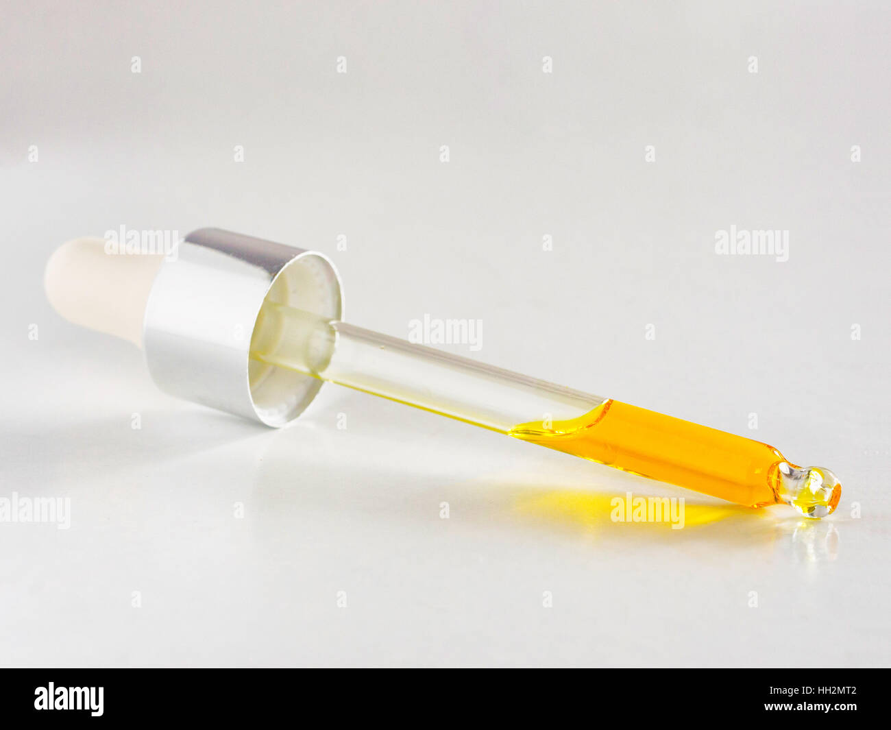 Essential oil or serum in pipette Stock Photo - Alamy