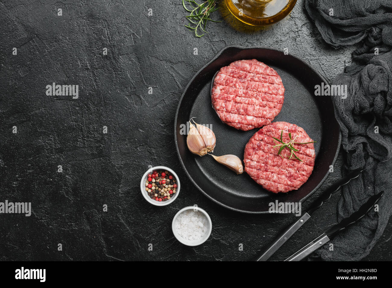 raw burgers - cutlets from organic beef meat with garlic and rosemary ...
