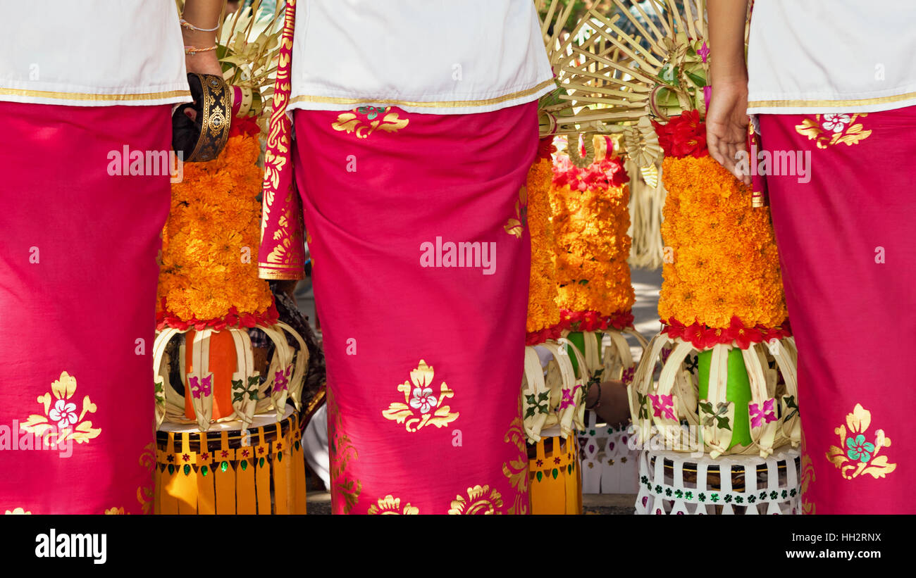 Group of Balinese women in costumes - sarong, with offering for ...