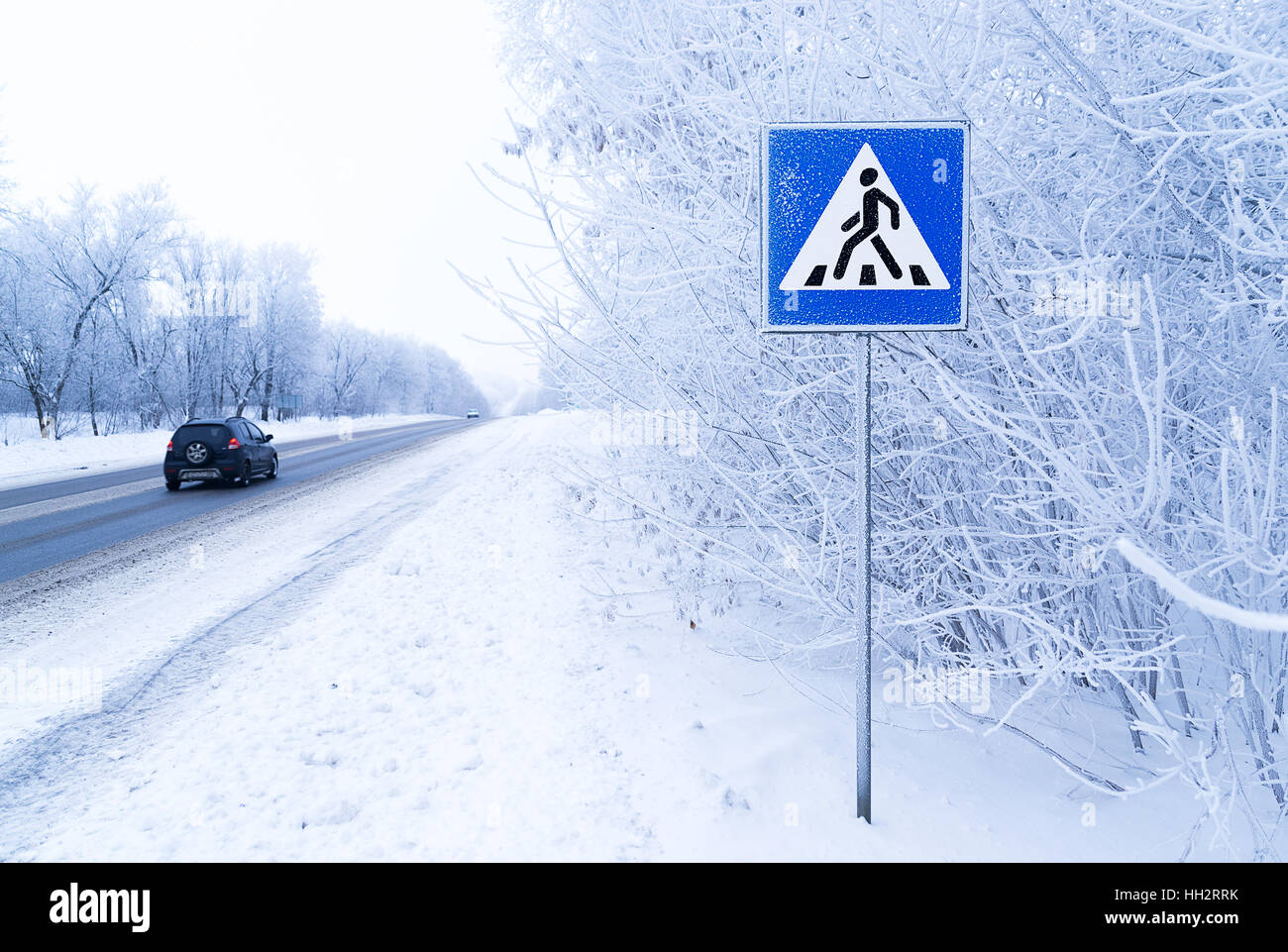 The road sign is on the snowy side Stock Photo - Alamy
