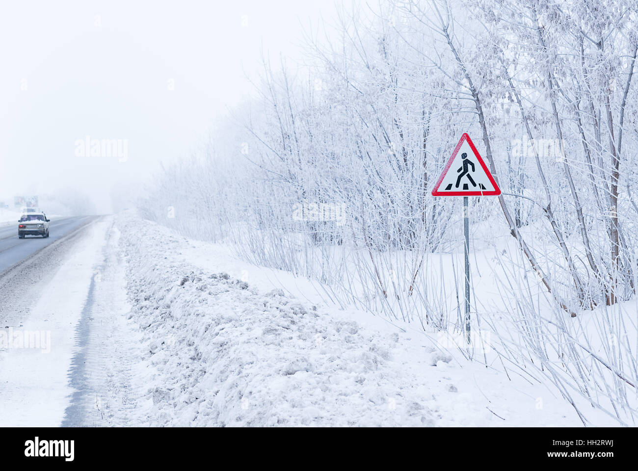 The road sign is on the snowy side Stock Photo - Alamy