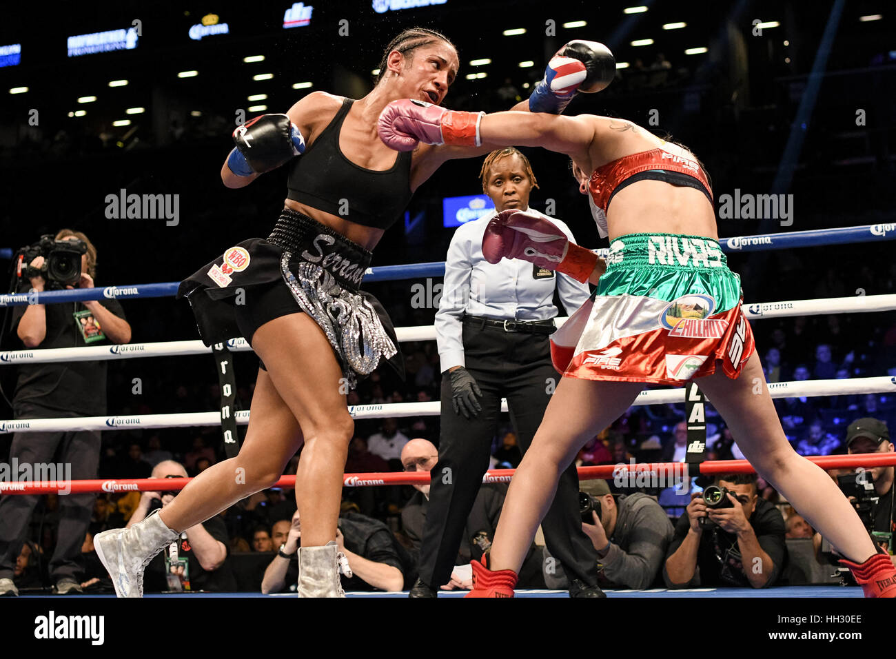 Brooklyn, USA. 14th Jan, 2017. Amanda Serrano (black and silver trunks ...