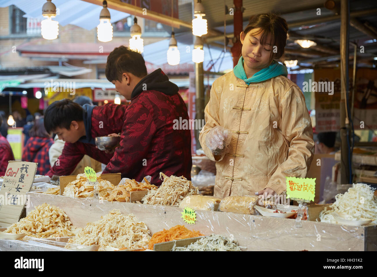 Taipei, Taiwan. 15th Jan, 2017. A vendor of various dried fish and ...