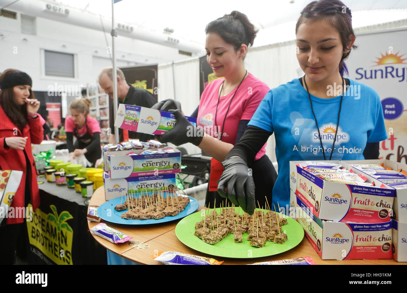 Vancouver, Canada. 15th Jan, 2017. Exhibitors prepare snacks samples ...