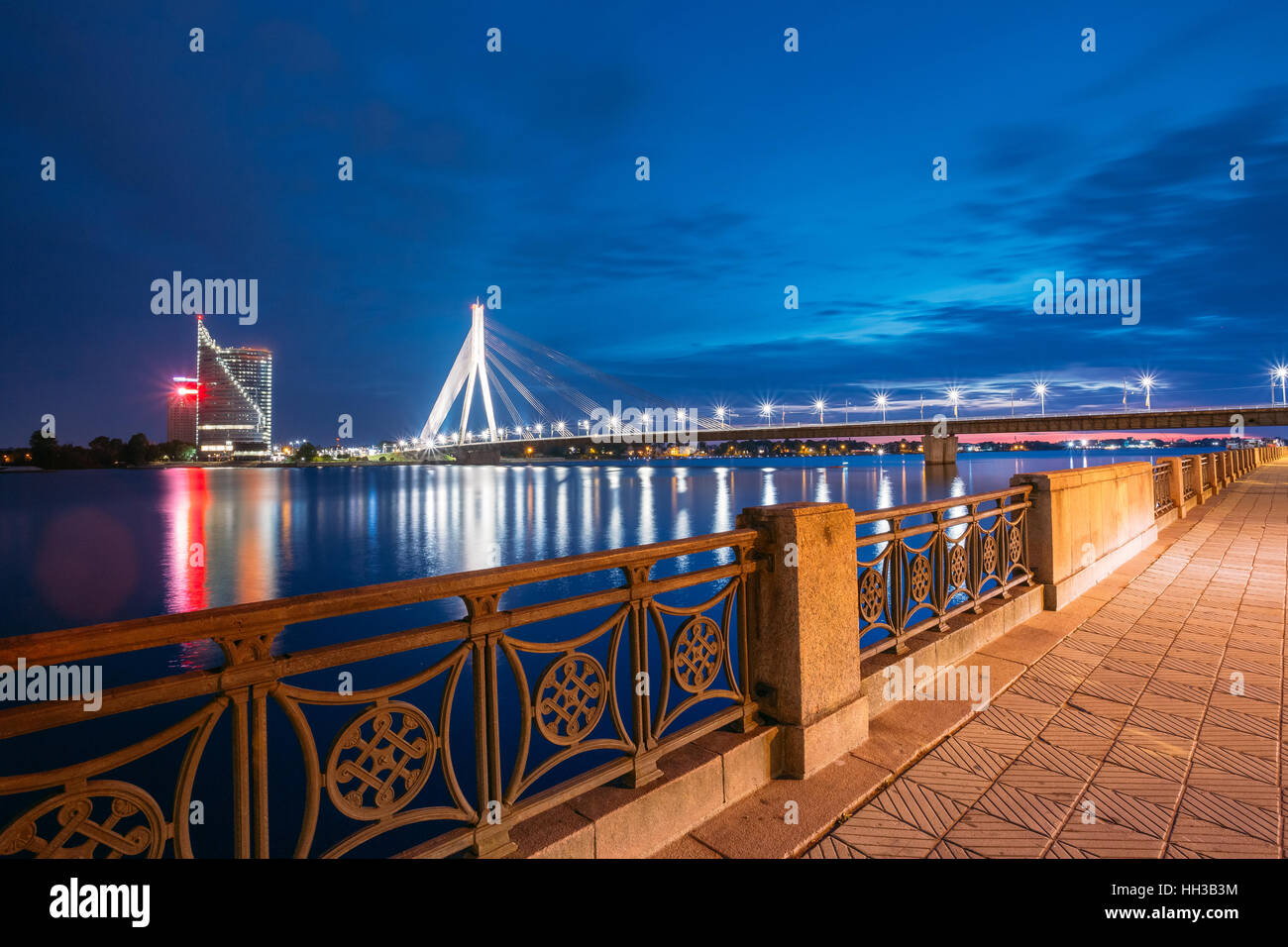 Riga, Latvia. View Of Famous Vansu Cable-Stayed Bridge In Bright Night ...