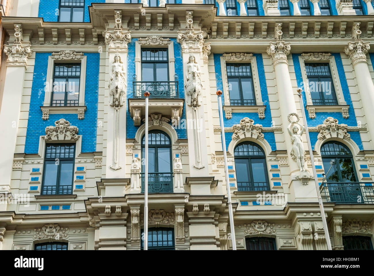 Beautiful decorated building facade with columns in art deco district ...