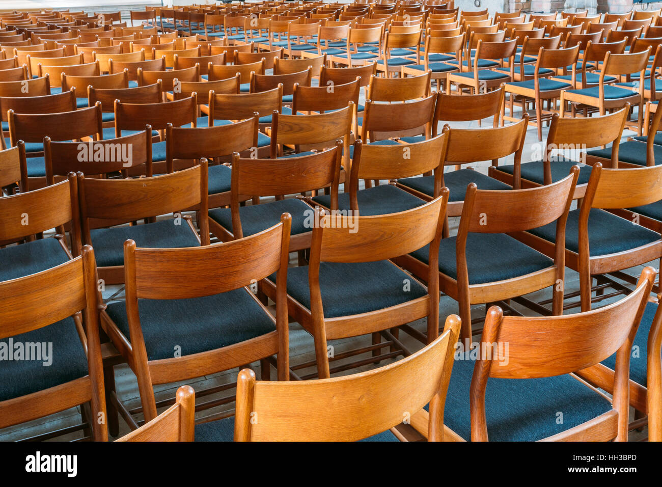 Many Empty The Same Wooden Chairs With Backrest And Blue Upholstery ...