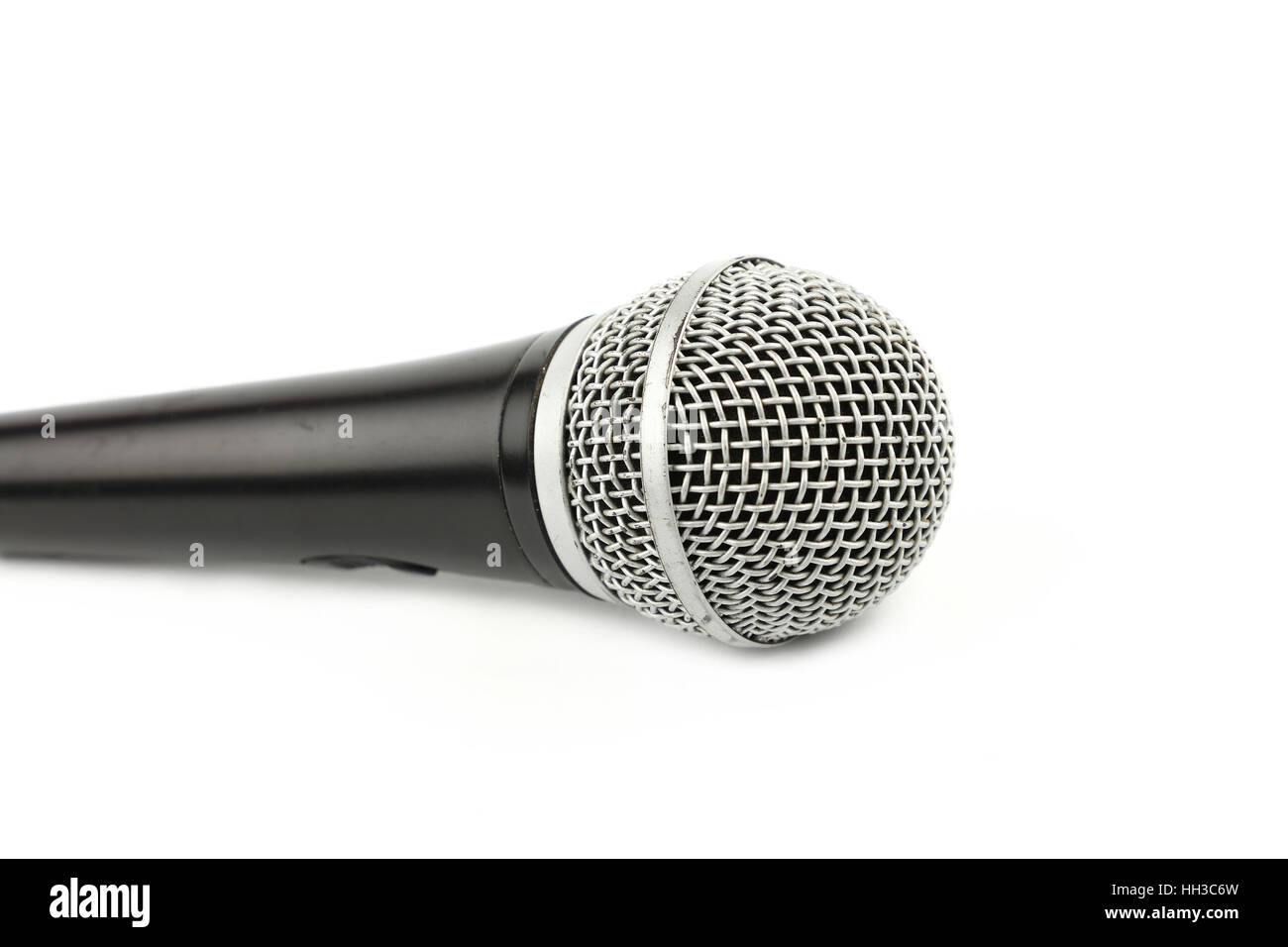 Vocal microphone side view close up on white background Stock Photo - Alamy