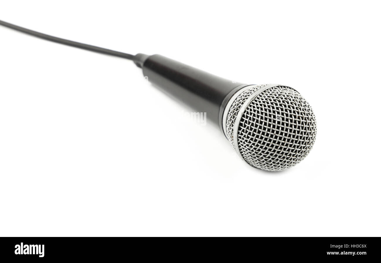 Black and silver vocal microphone with cable high angle side view close ...