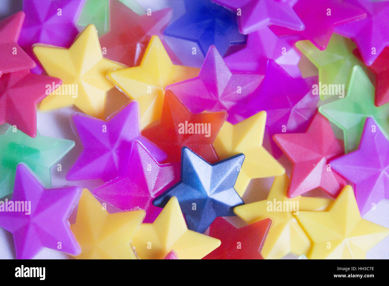 Colorful plastic stars Stock Photo - Alamy