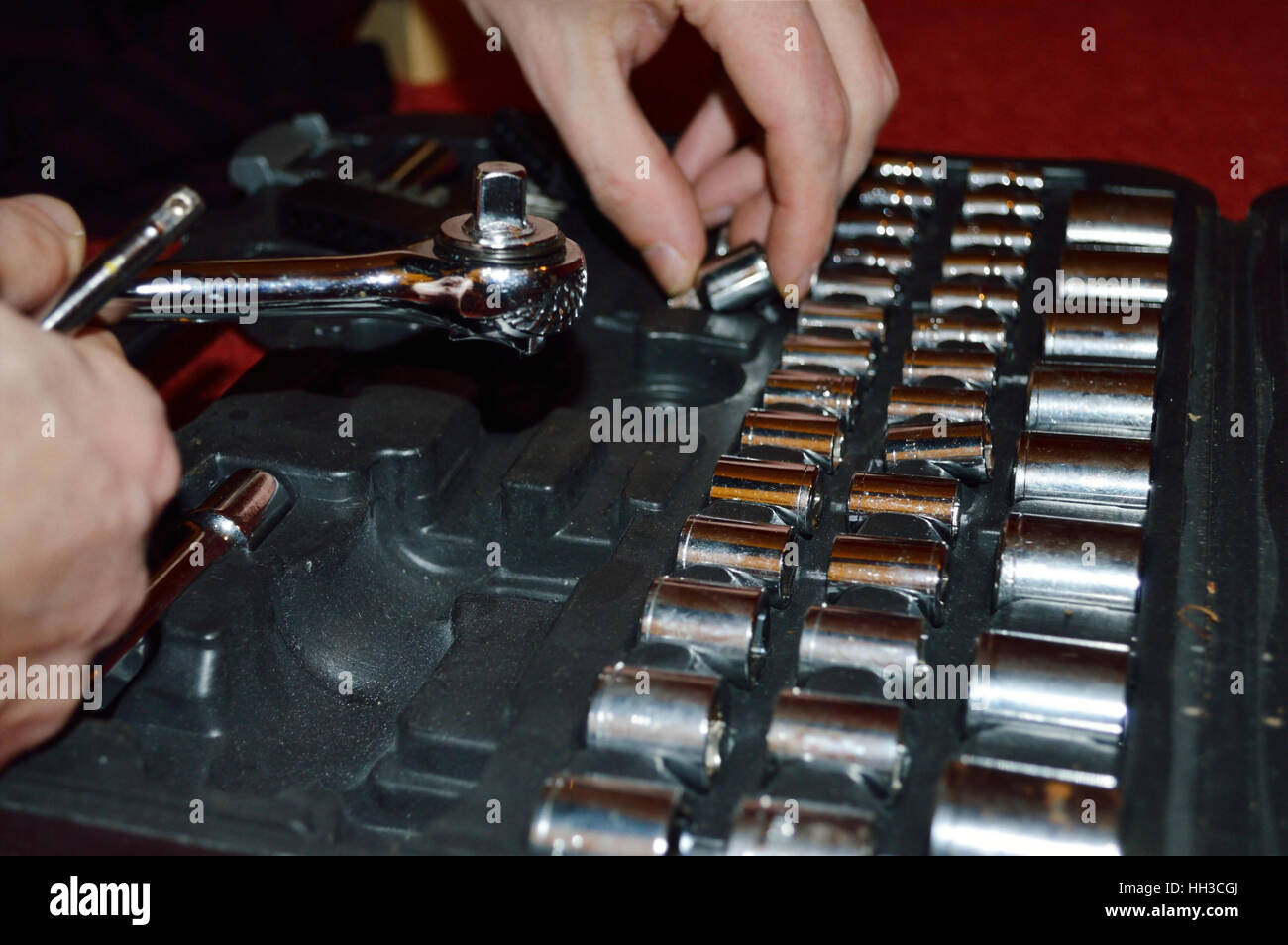 Man choosing tools from a toolbox Stock Photo - Alamy