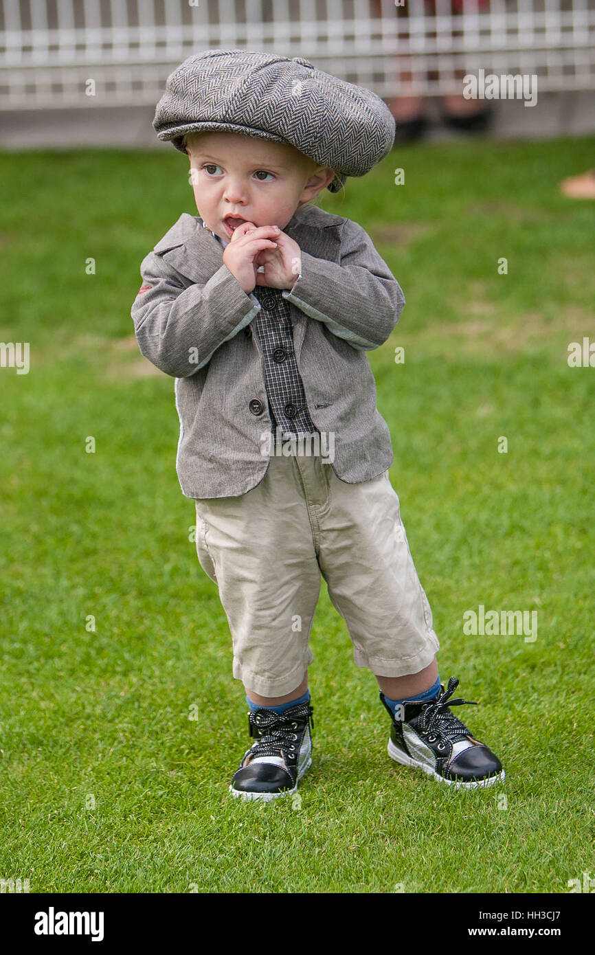 young boy in period dress at the Goodwood races for themed festivities ...