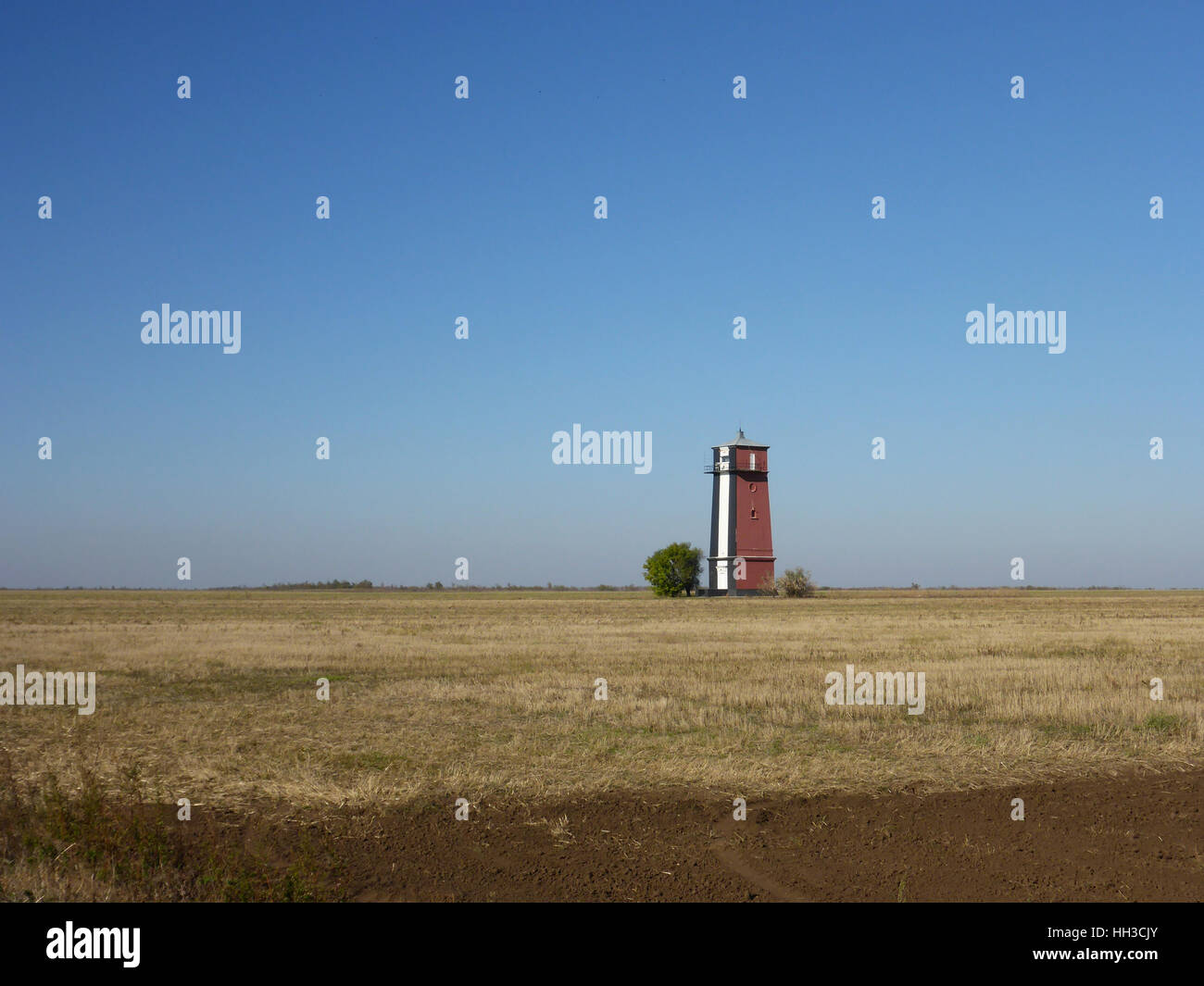 Lighthouse in the middle of a field Stock Photo - Alamy