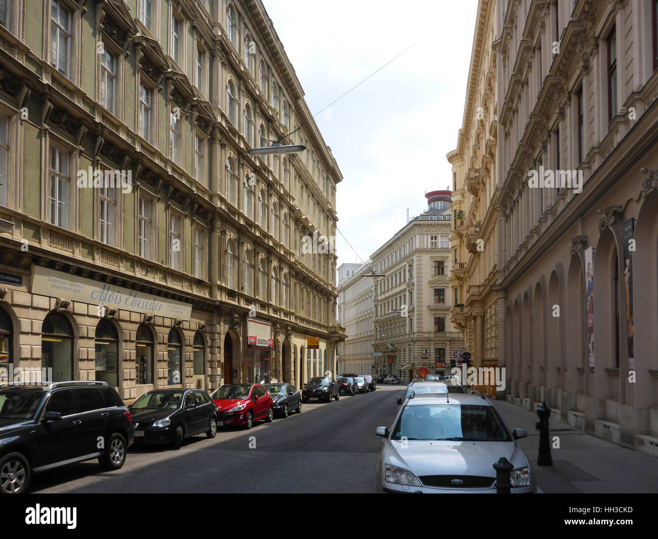 VIENNA, AUSTRIA - AUGUST 3, 2014: a side street view with parked cars ...