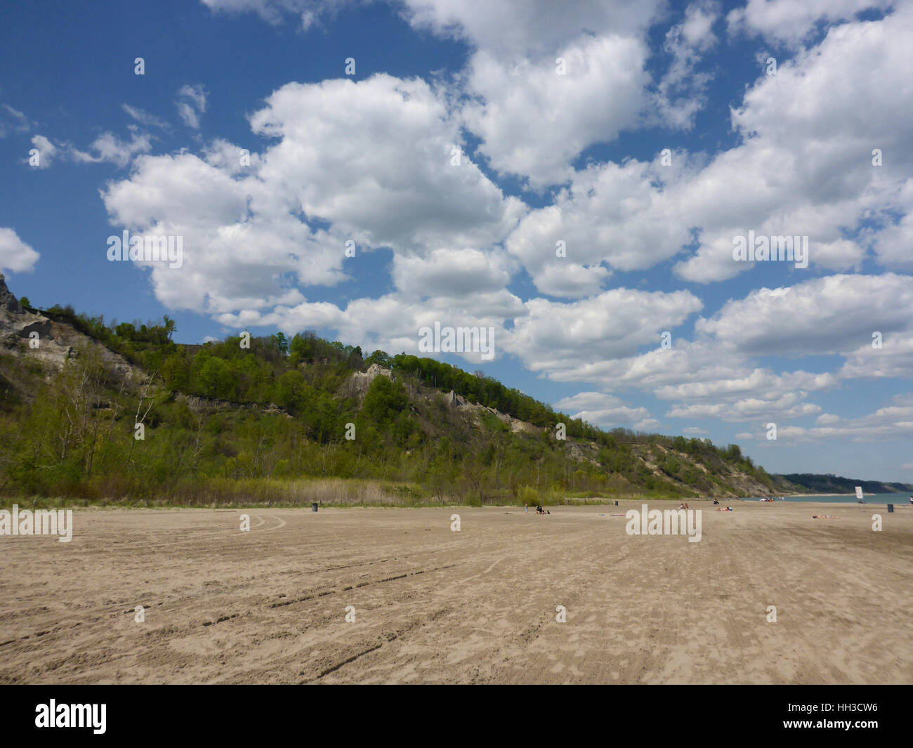Wide sandy beach with a boathouse Stock Photo - Alamy