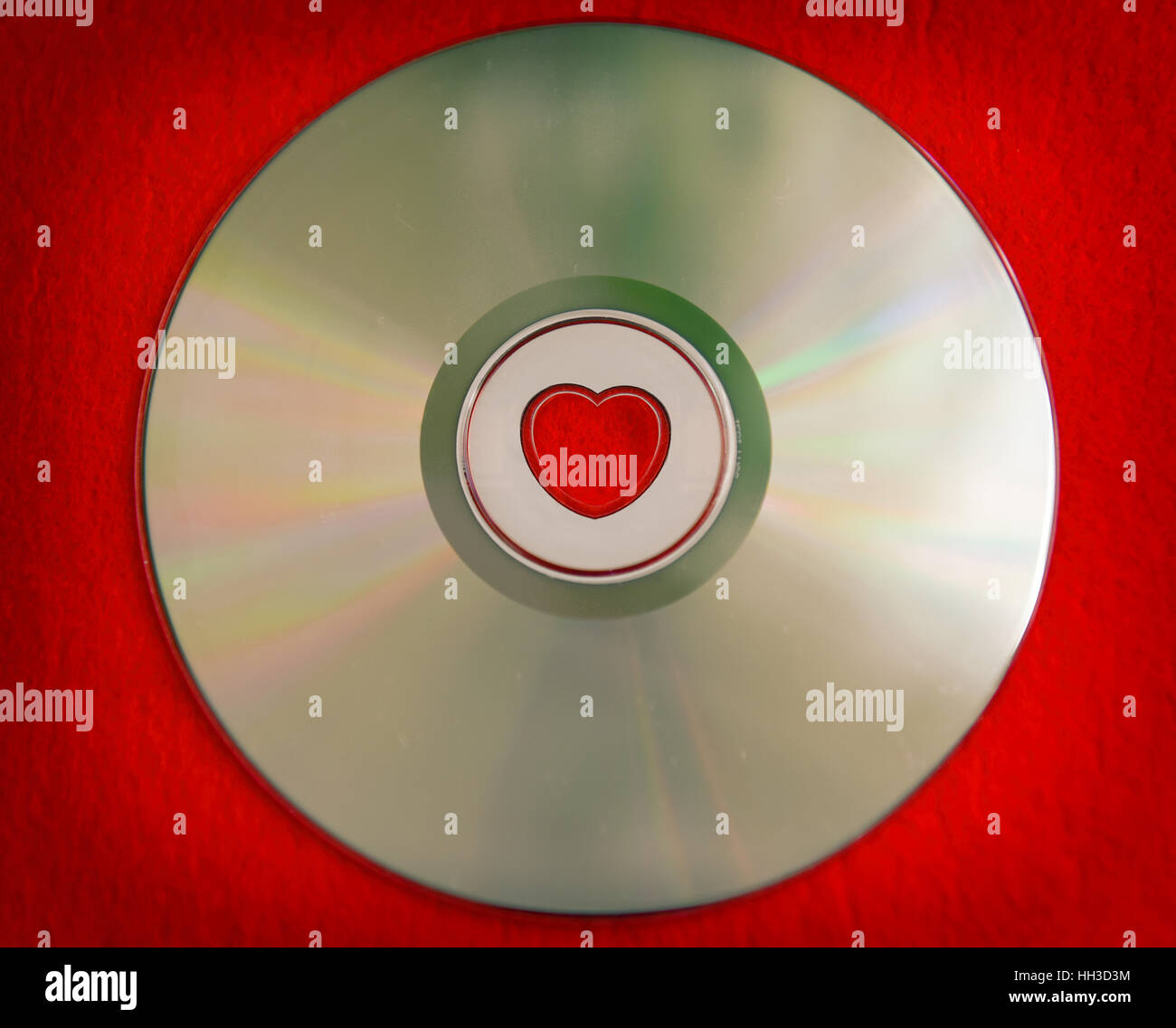 Valentine's day background - colorful CD disk with heart shape in the ...