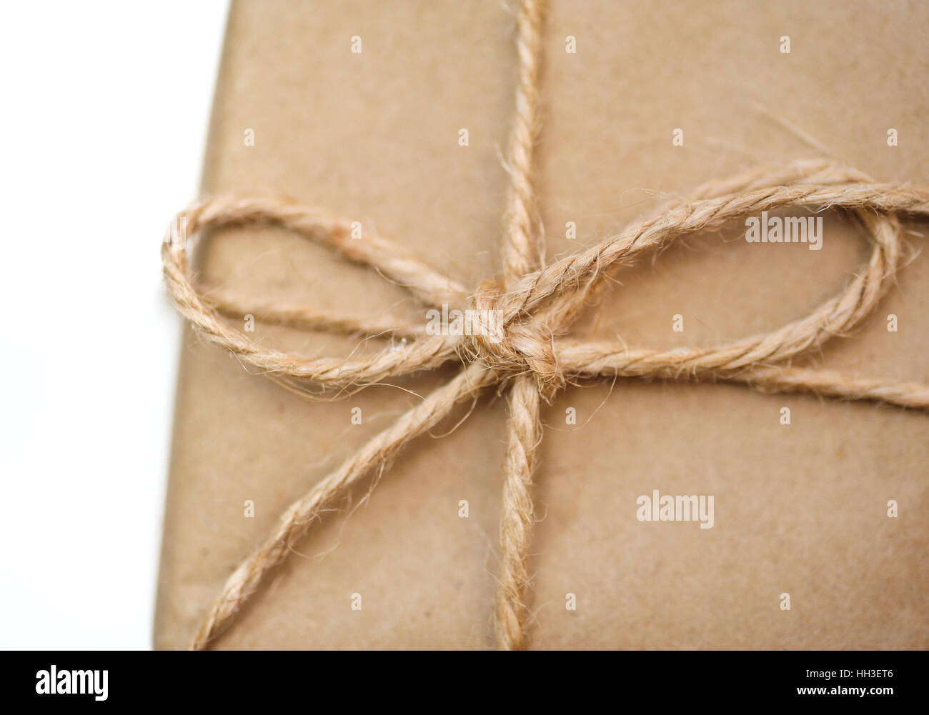 rope with a bow on the box kraft paper Stock Photo - Alamy