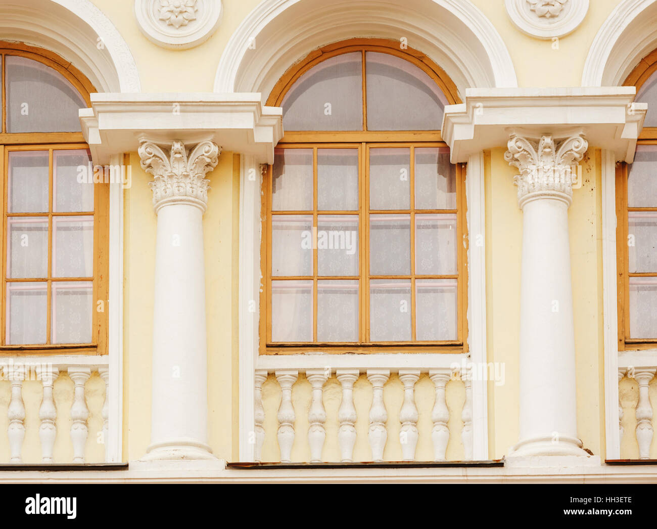 architecture of the historic building with Windows arches and columns ...