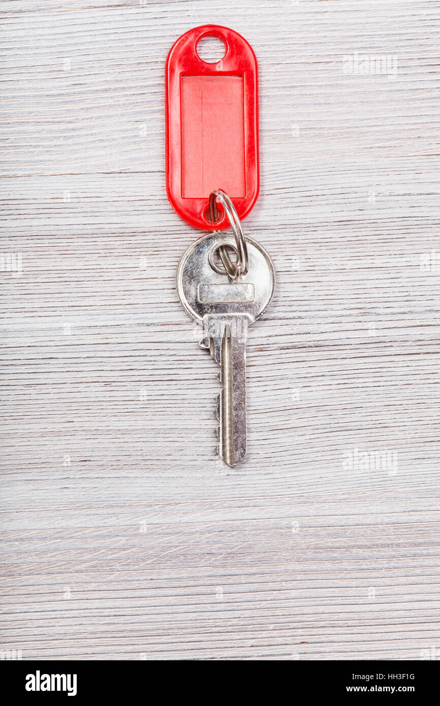 door key with red blank keychain on wood table Stock Photo - Alamy